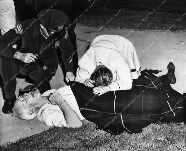 news photo police and others try to revive Lewis Stone in front of hom ...