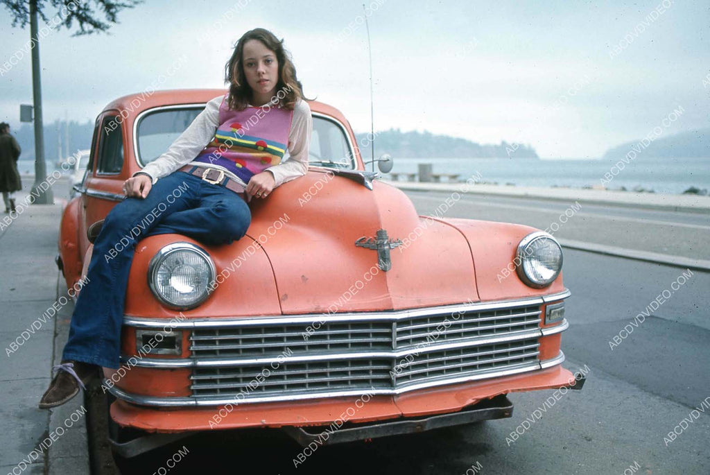 Mackenzie Phillips relaxing on the hood of a car 35m-16730 – ABCDVDVIDEO