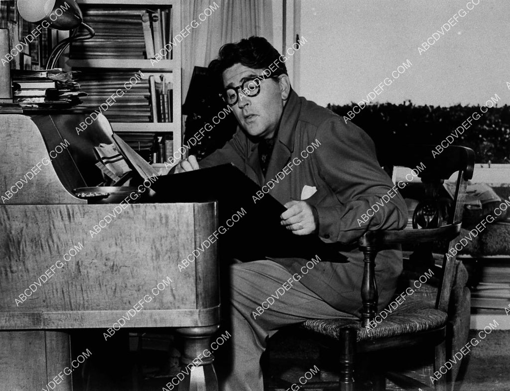 music composer and playwright Meredith Wilson sitting at his desk 8668 ...