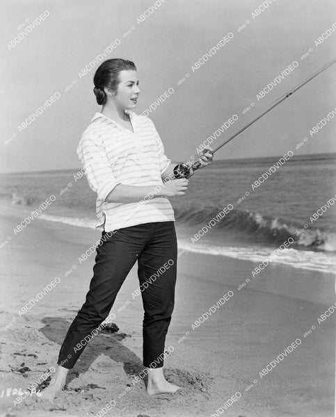 crp-03768 1957 photo Marianne Cook fishing on the beach film Four Girl ...