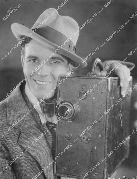 crp-04603 1928 Nick Stuart leaning on his newsreel camera silent film ...